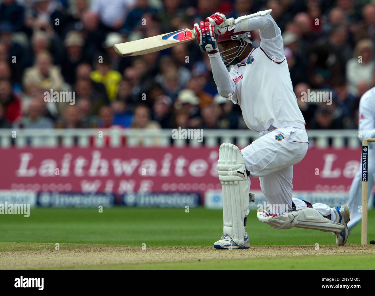 West Indies' Marlon Samuels hits a ball from England's Graham Onions ...