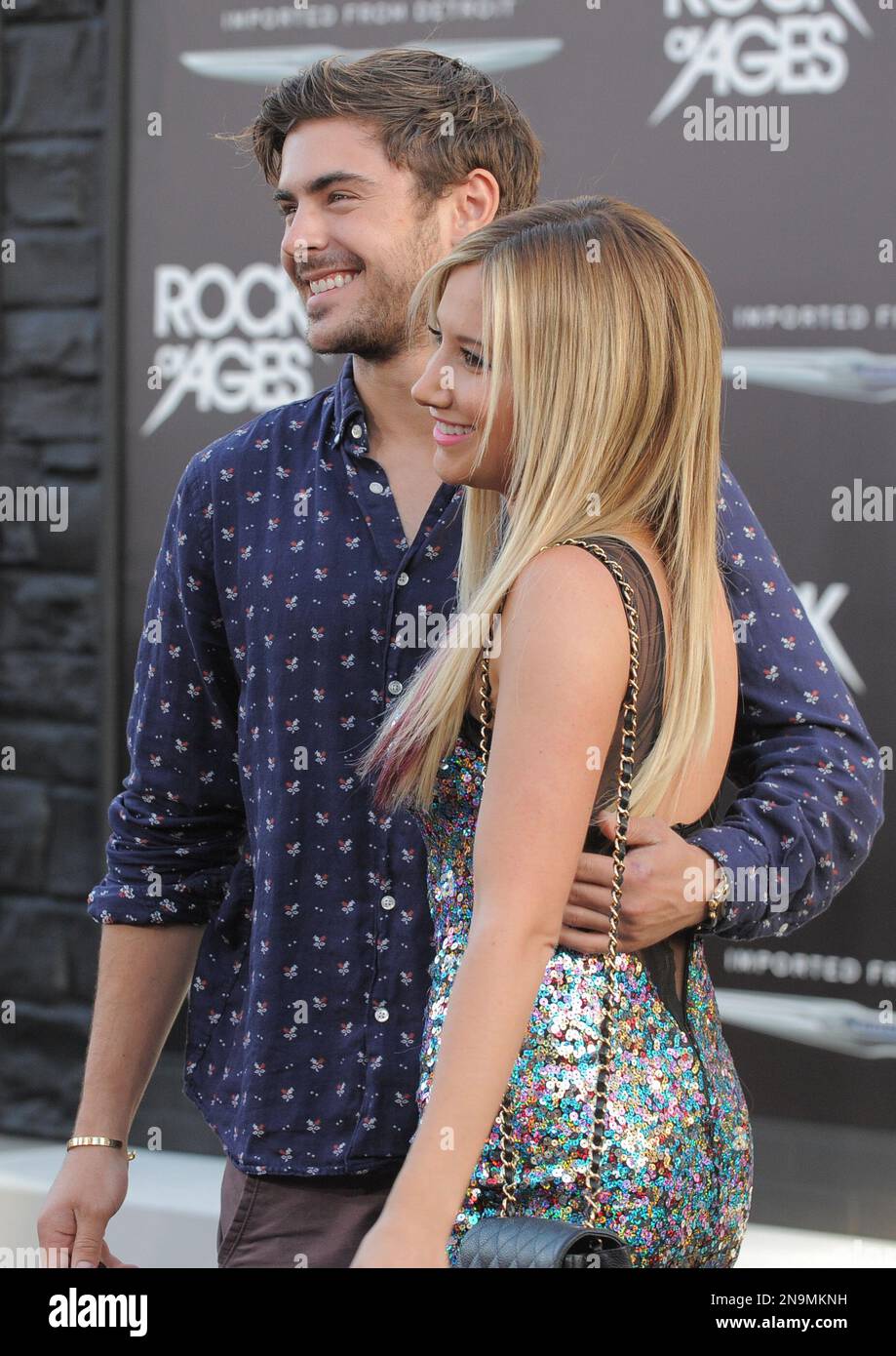 Zac Efron, left, and Ashley Tisdale arrive at the "Rock of Ages ...