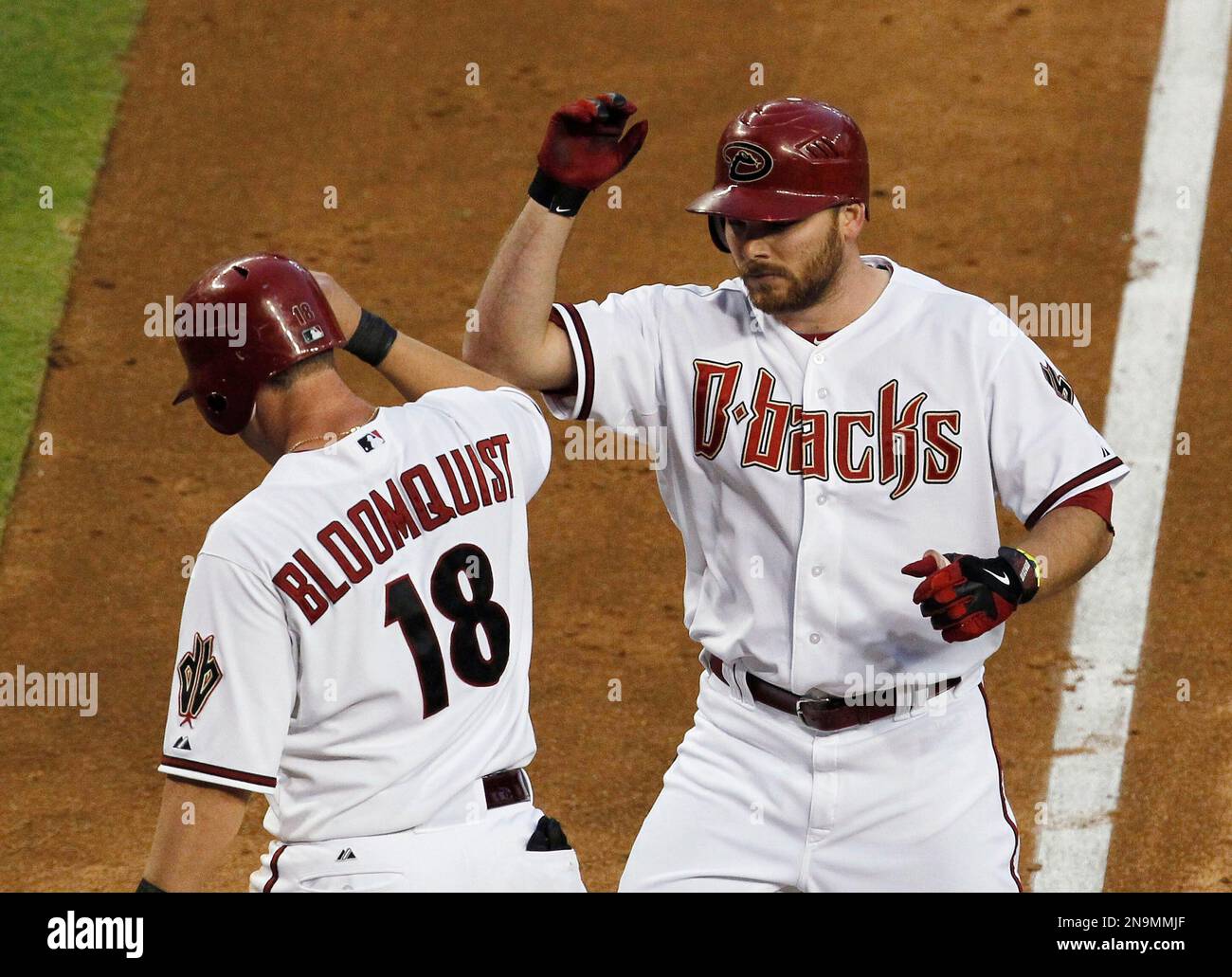 Arizona Diamondbacks' Jason Kubel, right, gets a high-five from ...