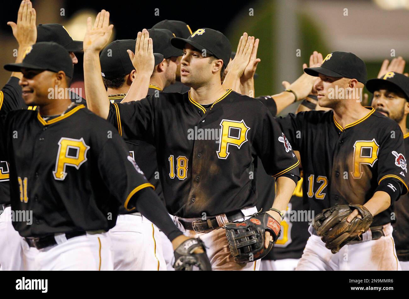 Pittsburgh Pirates' Neil Walker (18) and Clint Barmes (12) celebrate ...