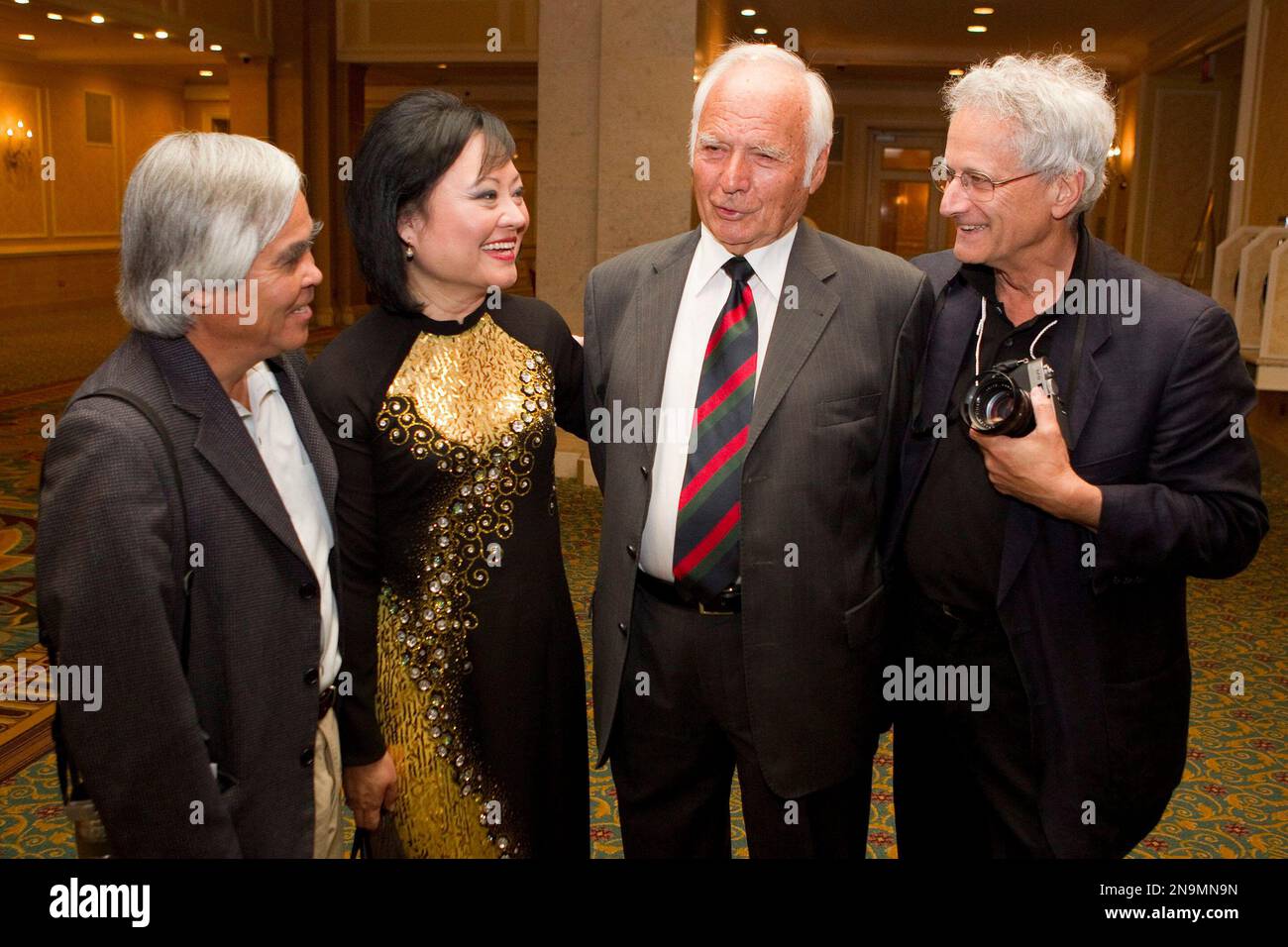Associated Press photographer Nick Ut, left to right, is pictured with ...