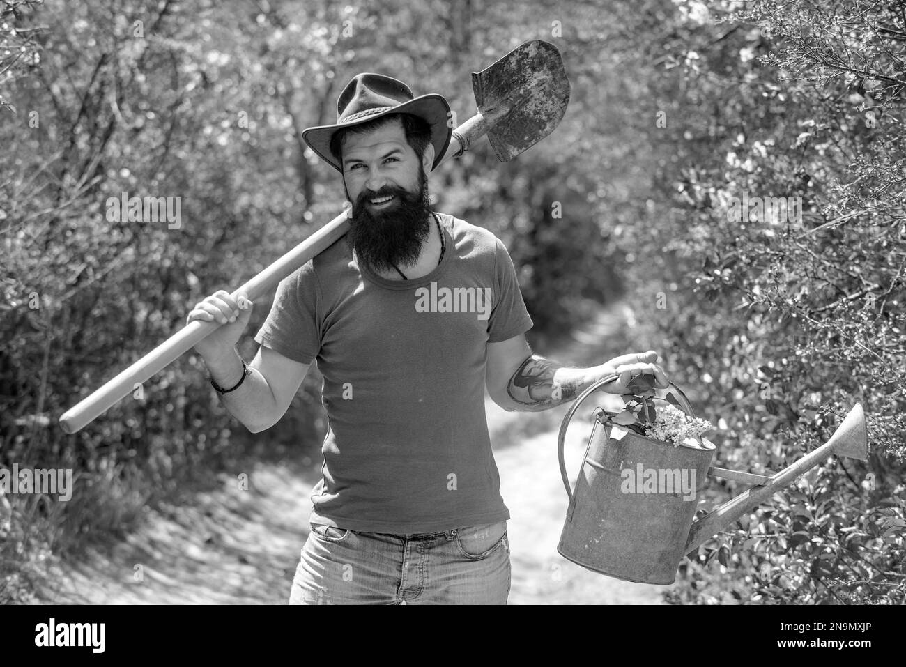 Funny Farmer with Shovel and watering can. Farmer working in field ...