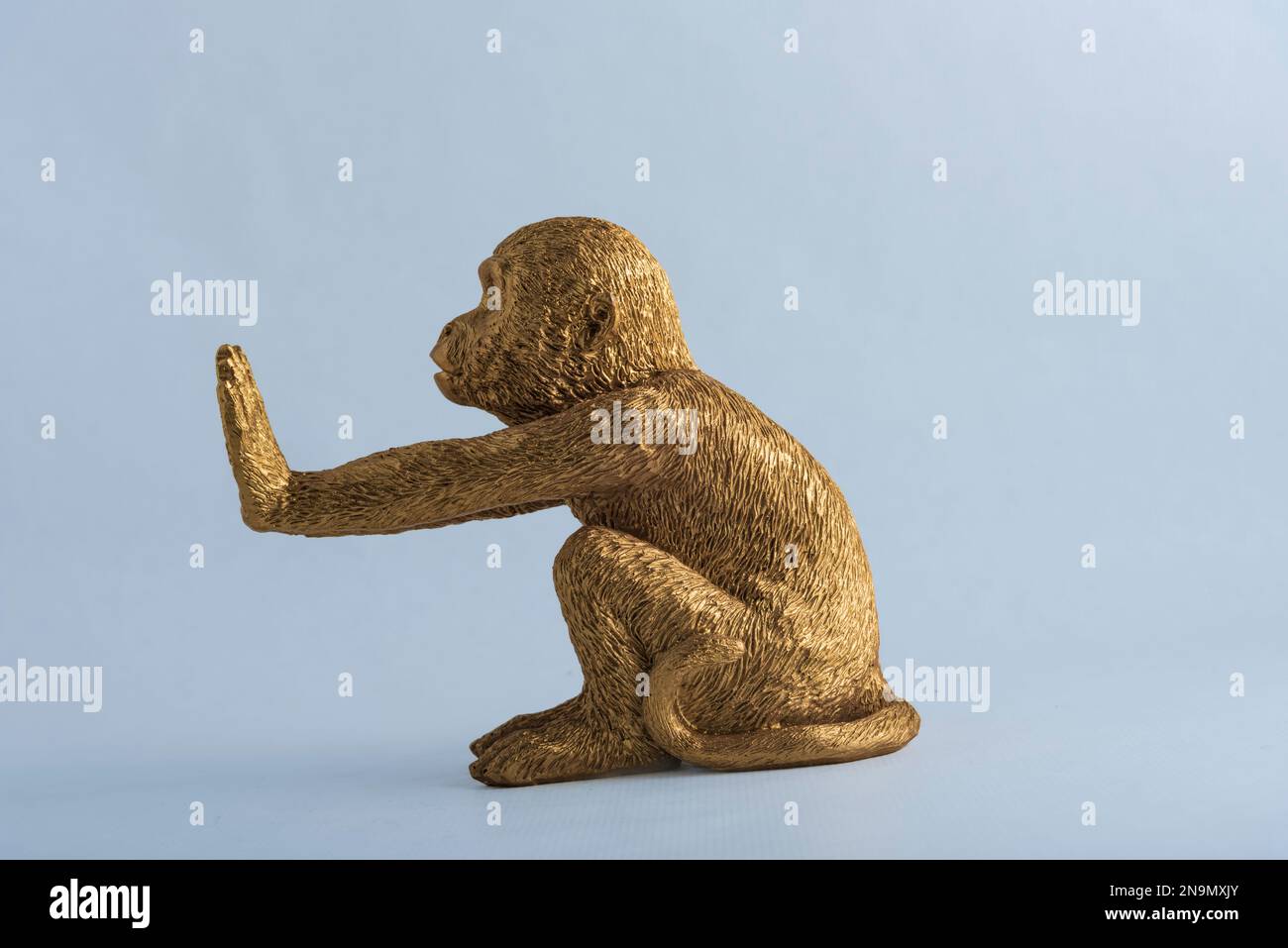 The image of the figure of a yellow plaster monkey for home decoration ...