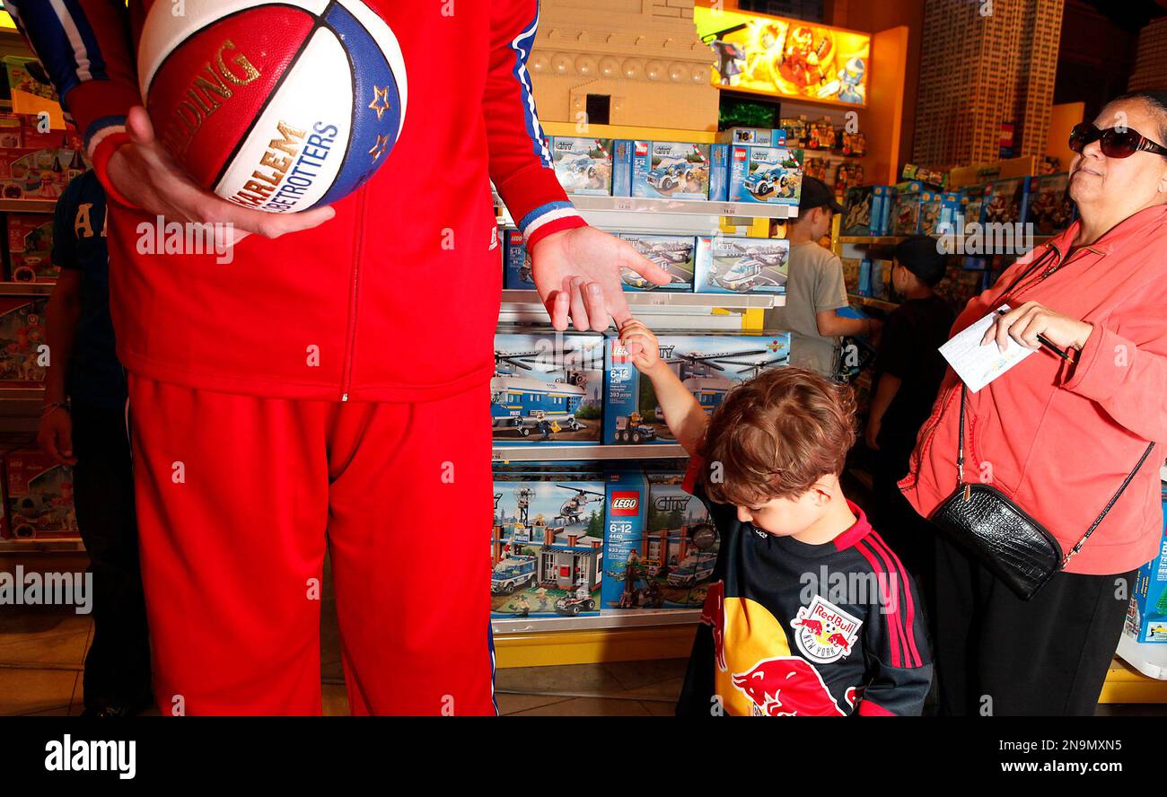 In this photo provided by the Harlem Globetrotters, a child takes the ...