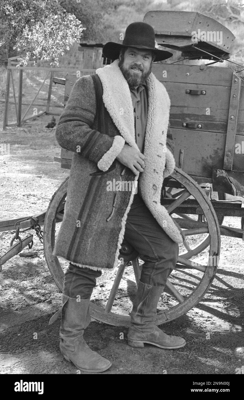 Former football great Merlin Olsen takes a break during the filming of ...