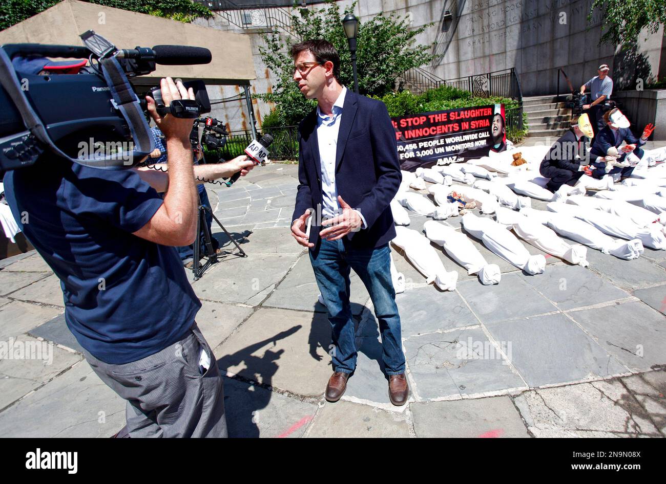 Avaaz Campaign Director Ian Bassin appears among 49 shrouded figures at ...