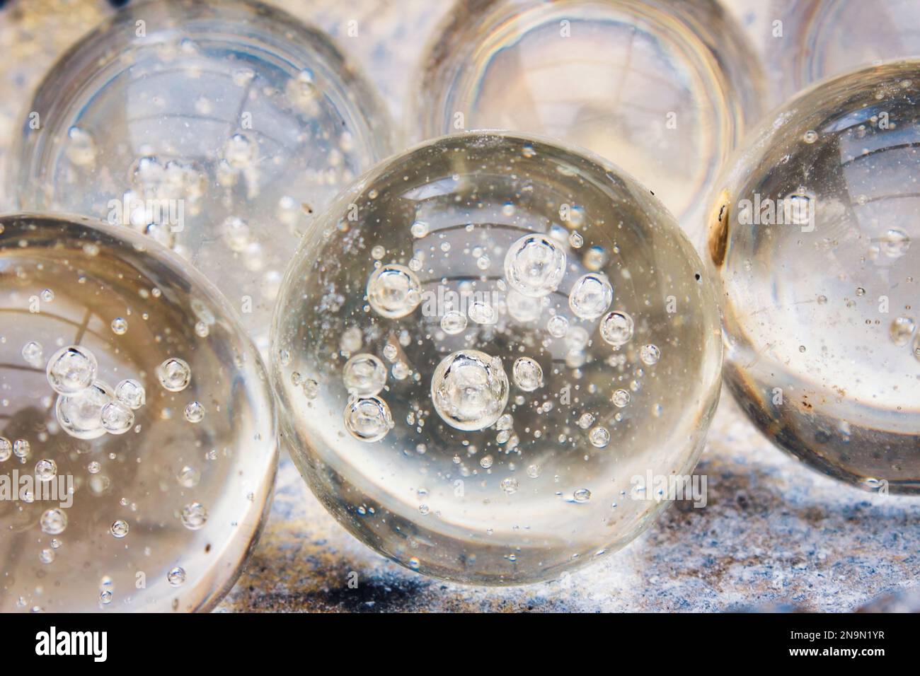 Close-up photo of glass spherical decorative baubles with air bubbles ...