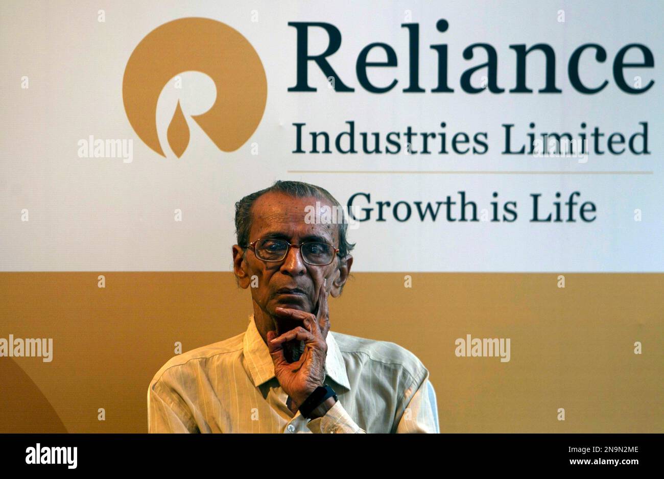 A shareholder waits to take part in Reliance Industries' annual general ...