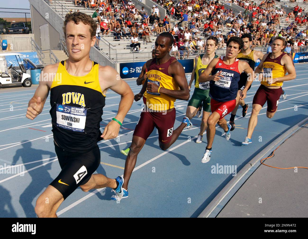 Iowa's Erik Sowinski, left, leads the field during an 800-meter run ...