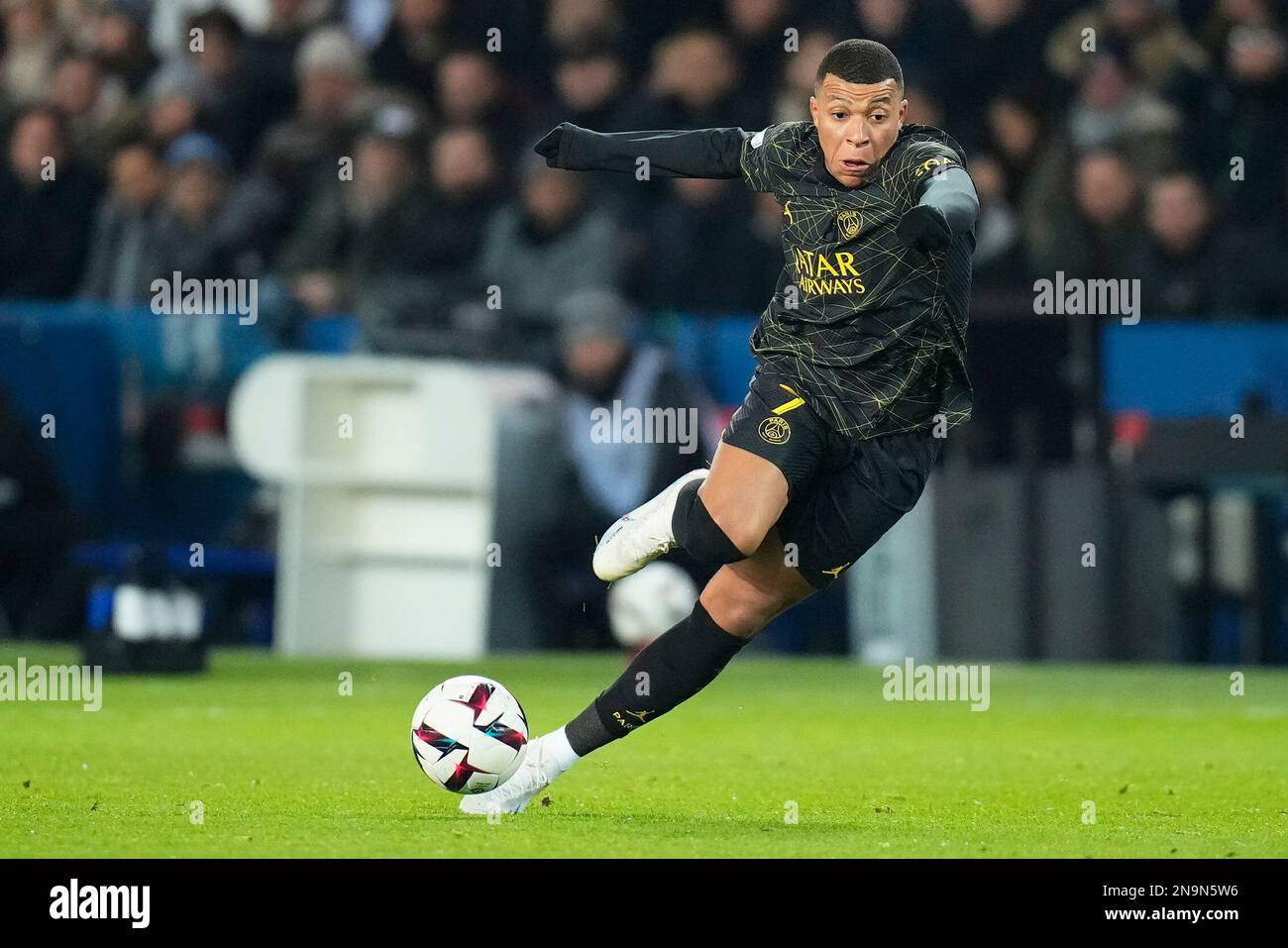 PARIS, FRANCE - JANUARY 29: Kylian Mbappe controls the ball while ...