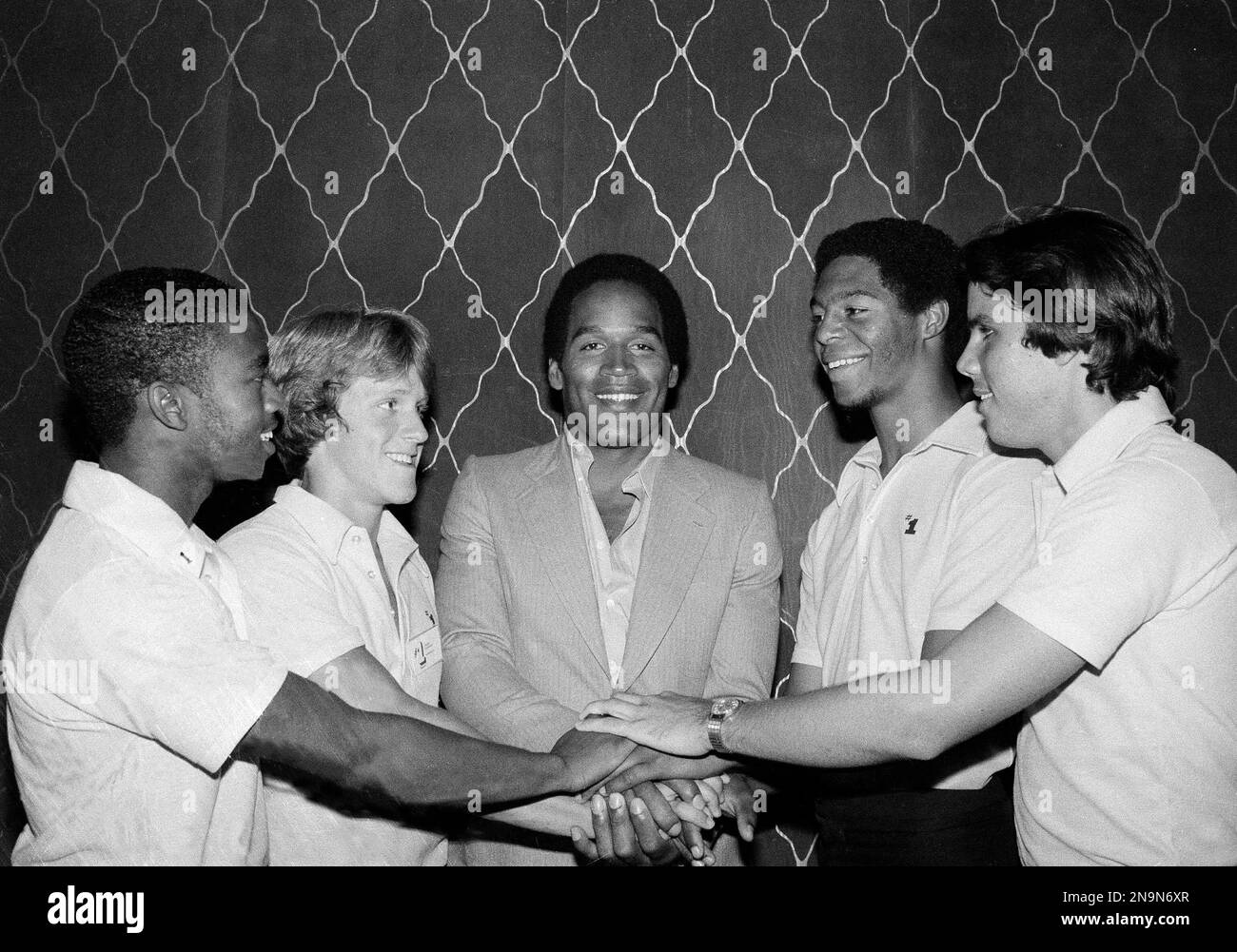 Football star O.J. Simpson poses in New York with some of the winners ...