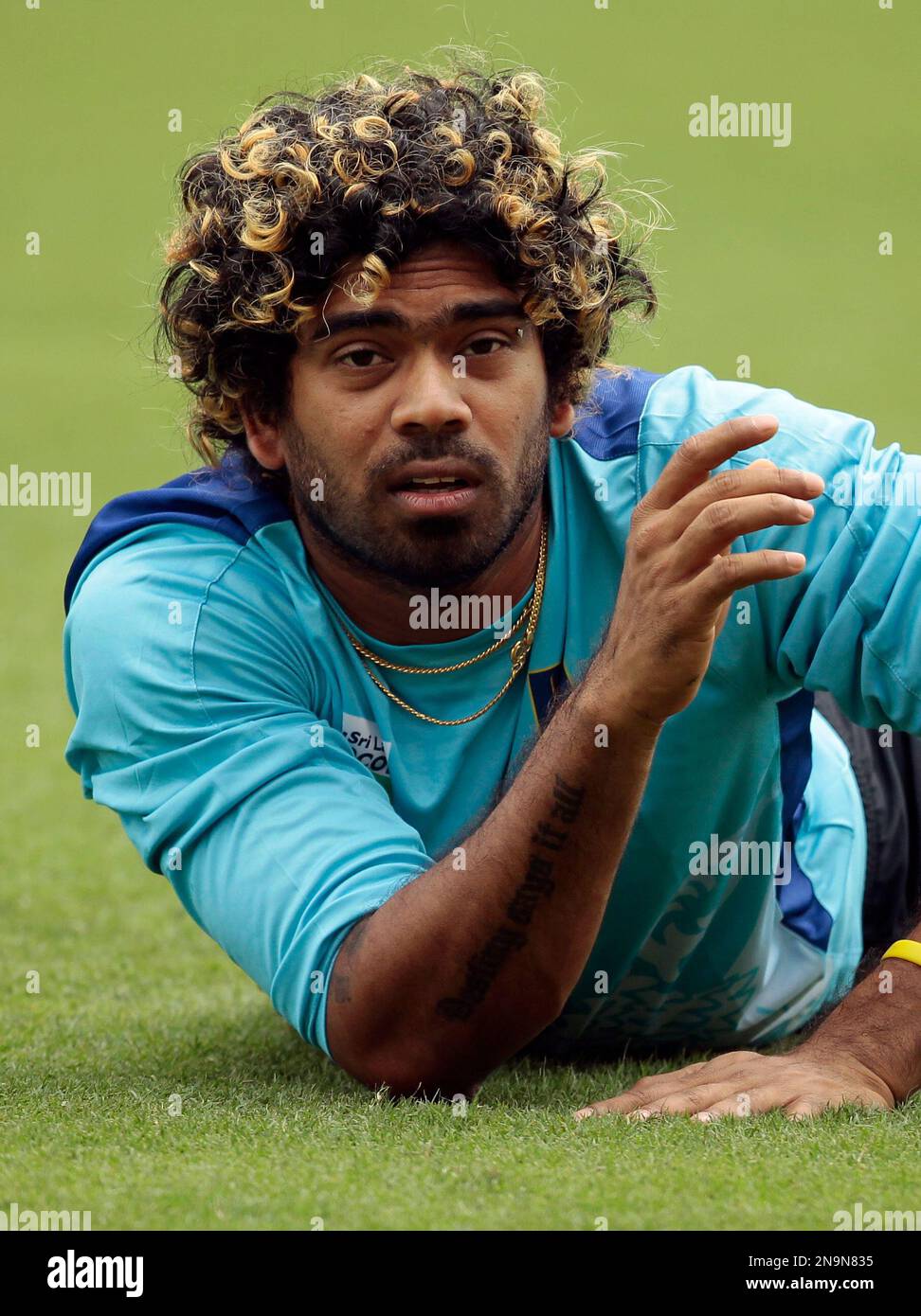 Sri Lankan cricketer Lasith Malinga looks on during a practice session ...