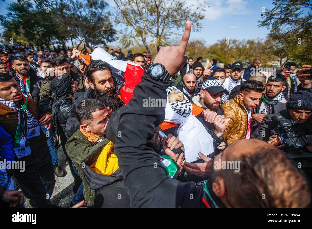 (EDITOR'S NOTE: Image depicts death) Mourners carry the body of ...