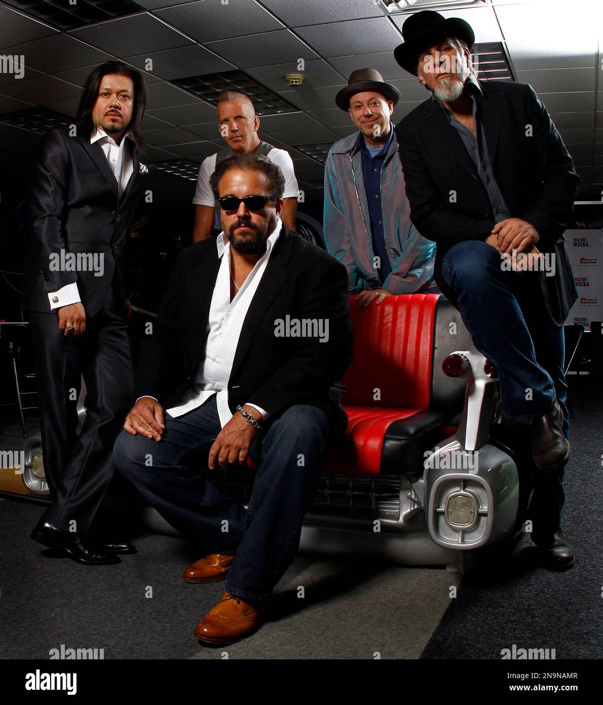 Raul Malo, seated, of musical group the Mavericks, poses for a portrait ...