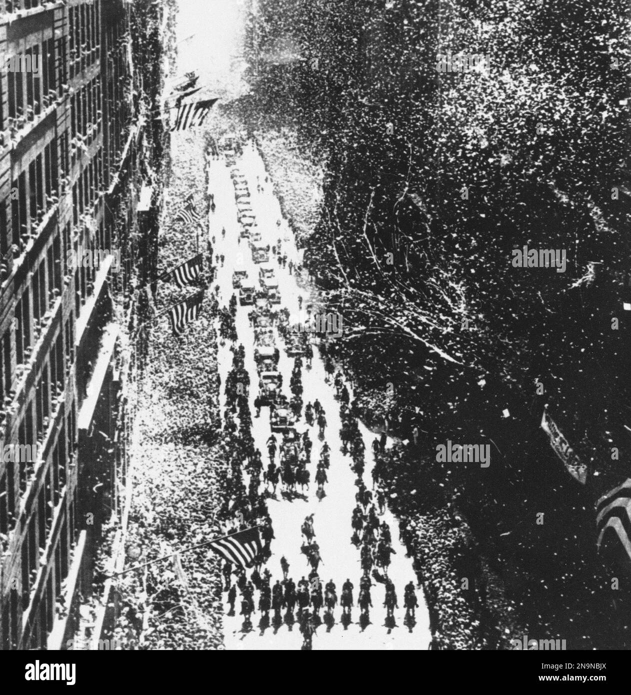 This is a general view of the ticker tape parade and crowds lining the ...