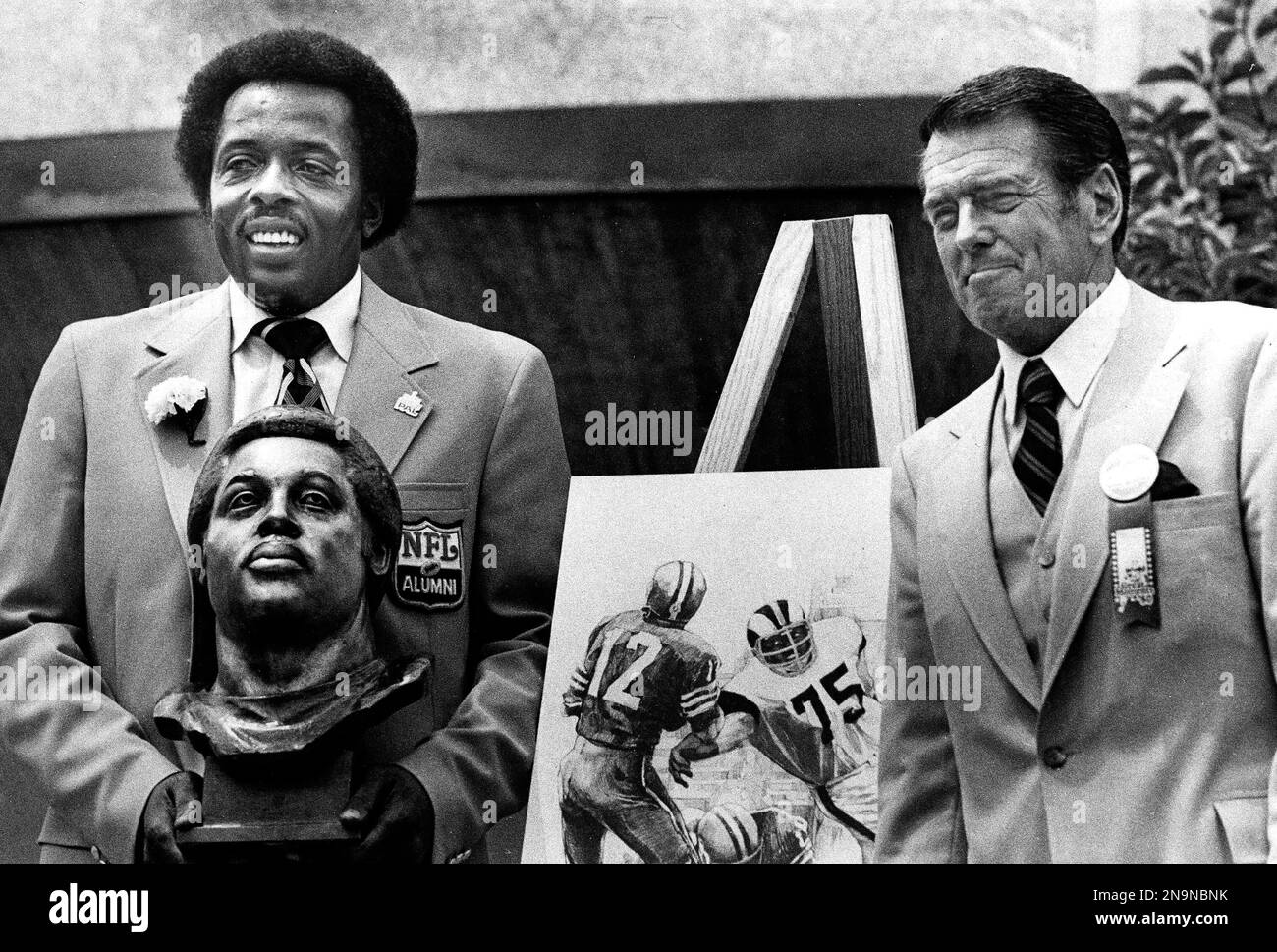 Former Los Angeles Rams defensive end Deacon Jones, left, poses with ...