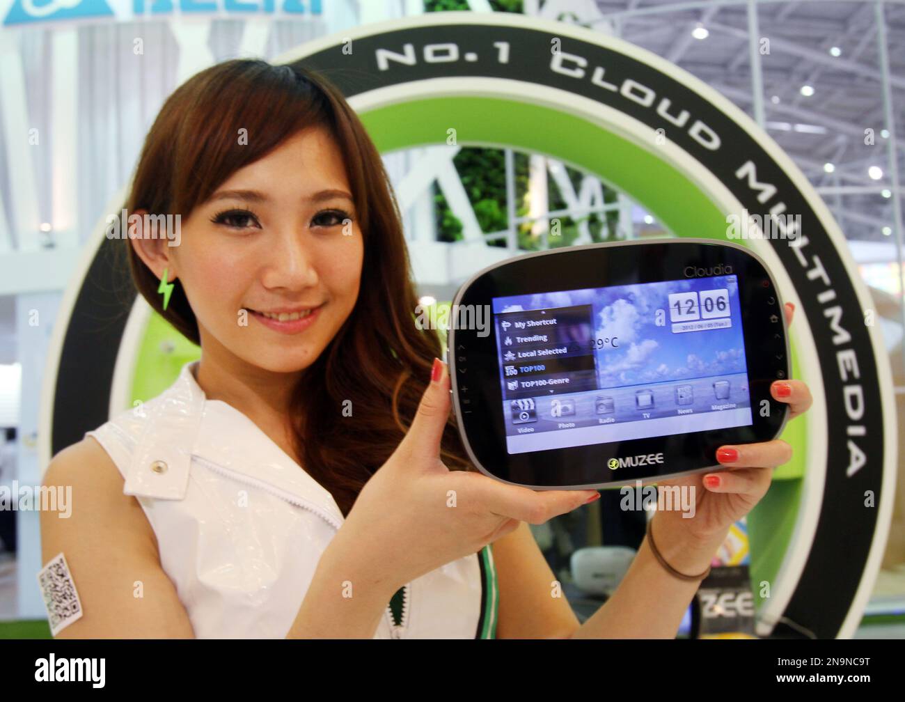 A model displays Taiwanese Muzee Corp.'s portable multimedia player Cloudia during the Computex ...
