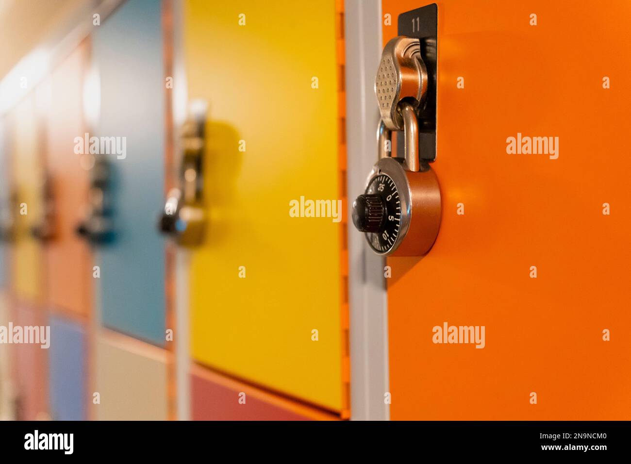 Combination locks on colorful school lockers Stock Photo - Alamy