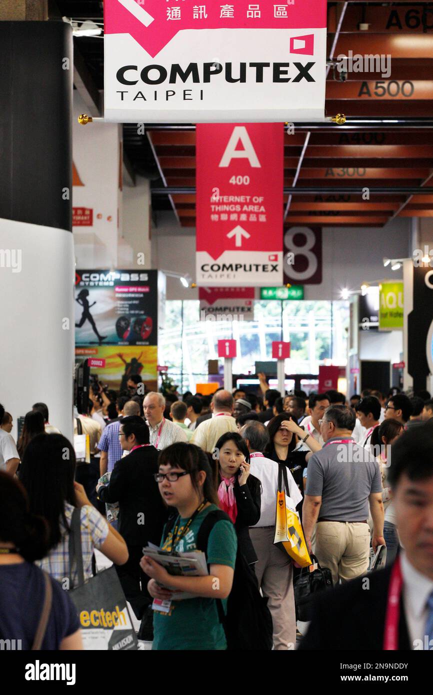 Visitors and vendors arrive on the opening day of the Computex exhibition at the Taipei World ...