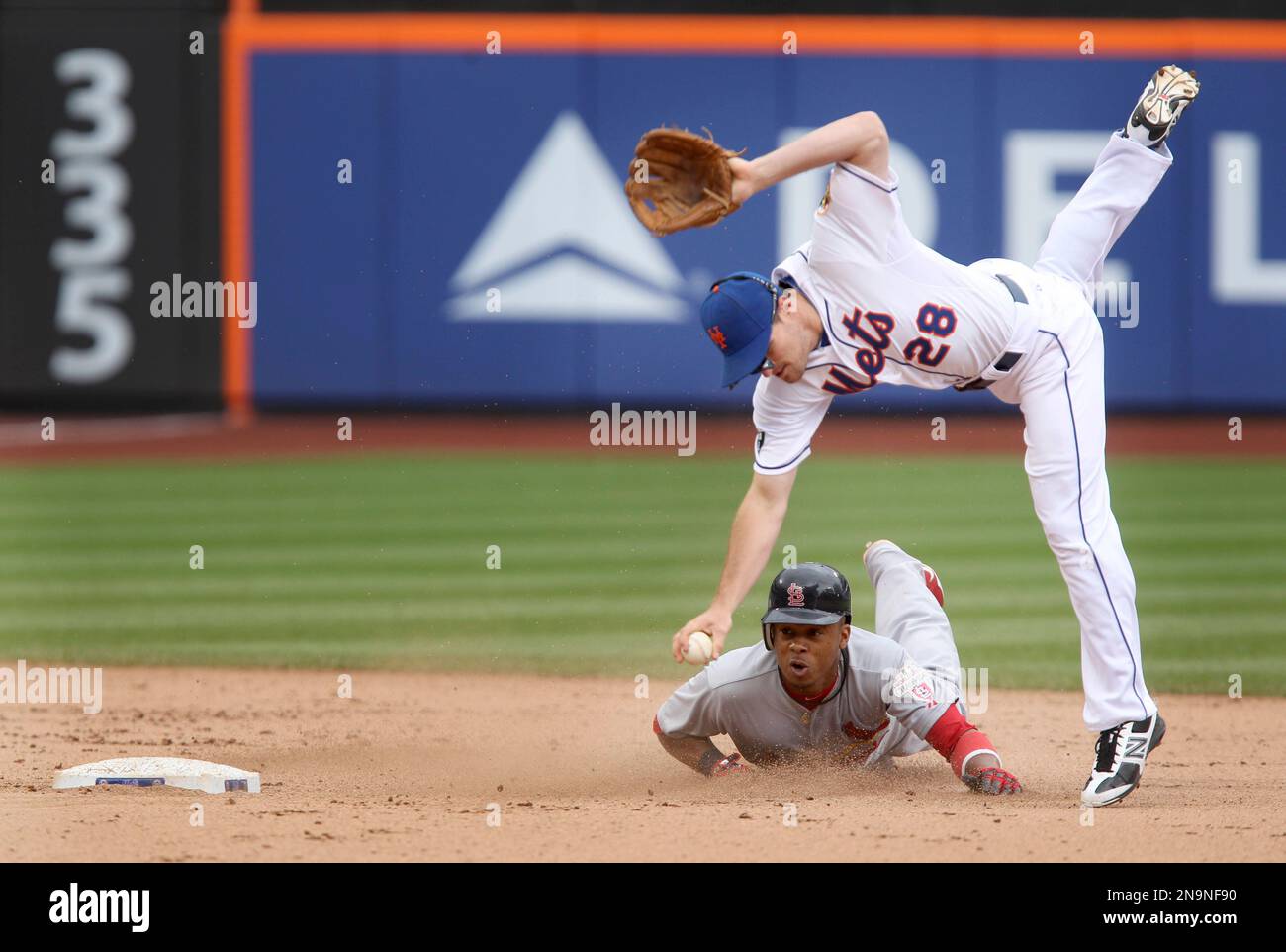 New York Mets second baseman Daniel Murphy, top, tags out St. Louis ...