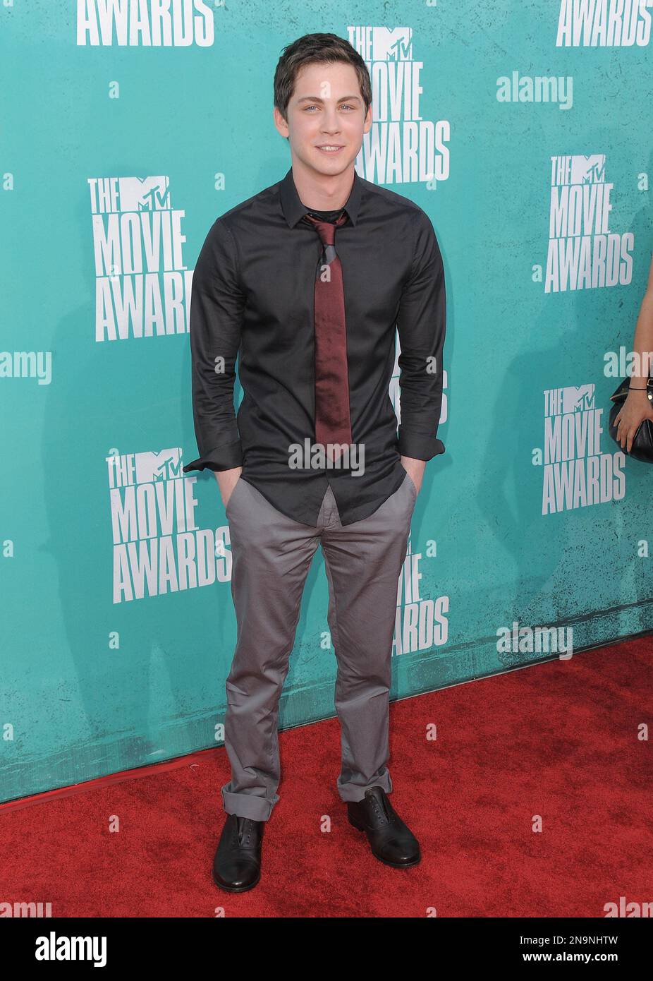 Logan Lerman arrives at the MTV Movie Awards on Sunday, June 3, 2012 in ...