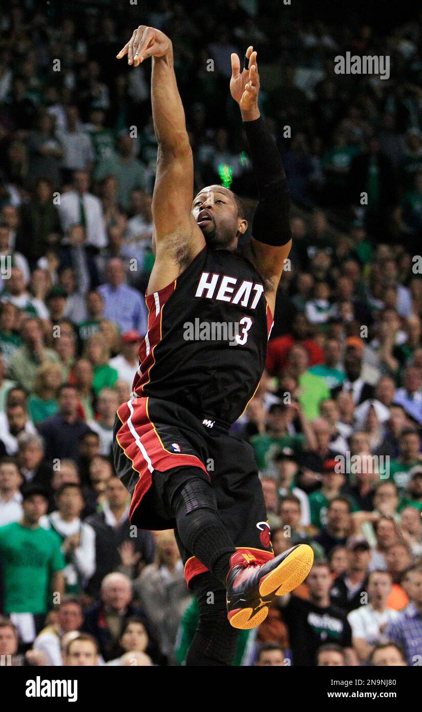 Miami Heat guard Dwyane Wade (3) takes a final shot against the Boston ...