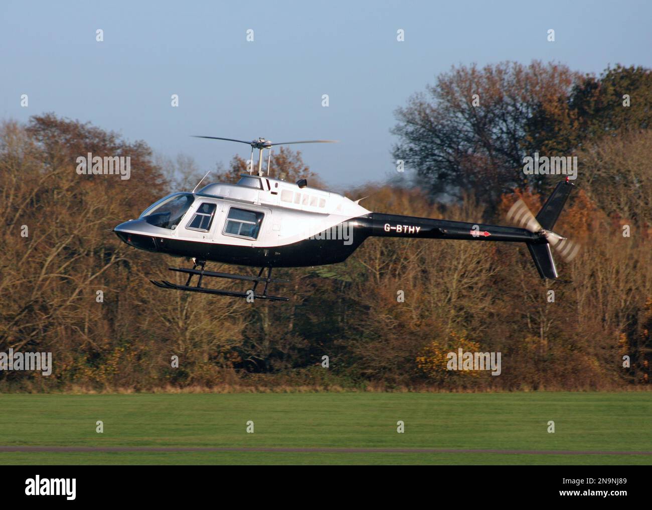 A Bell 206B JetRanger helicopter arriving at Redhill Aerodrome Surrey ...
