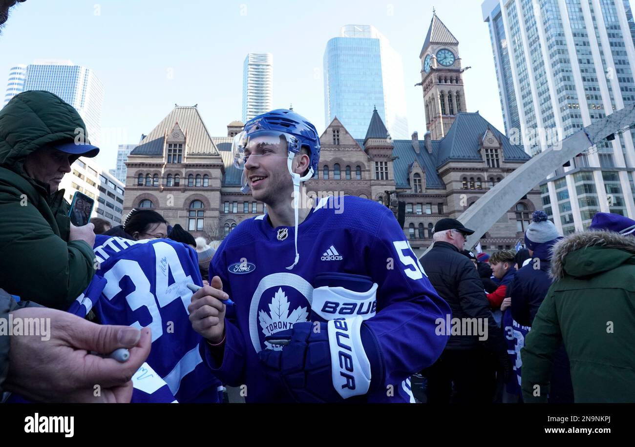 Toronto Maple Leafs' left wing Michael Bunting (58) signs an autograph ...