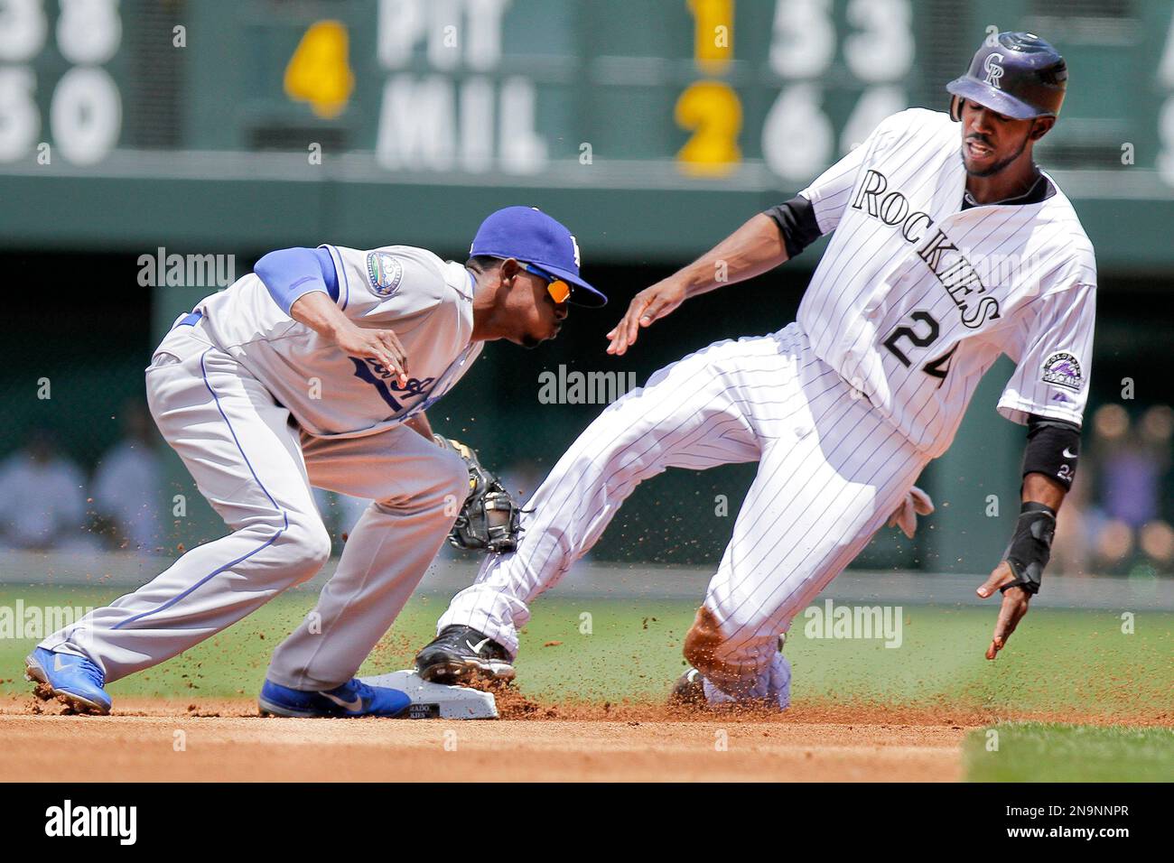 Colorado Rockies' Dexter Fowler (24) steals second base with Los ...
