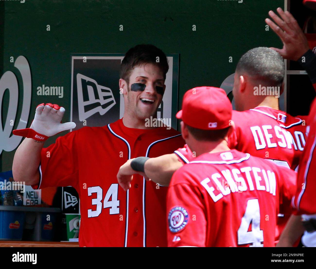 Washington Nationals' Bryce Harper (34) reacts with batting coach Rick ...