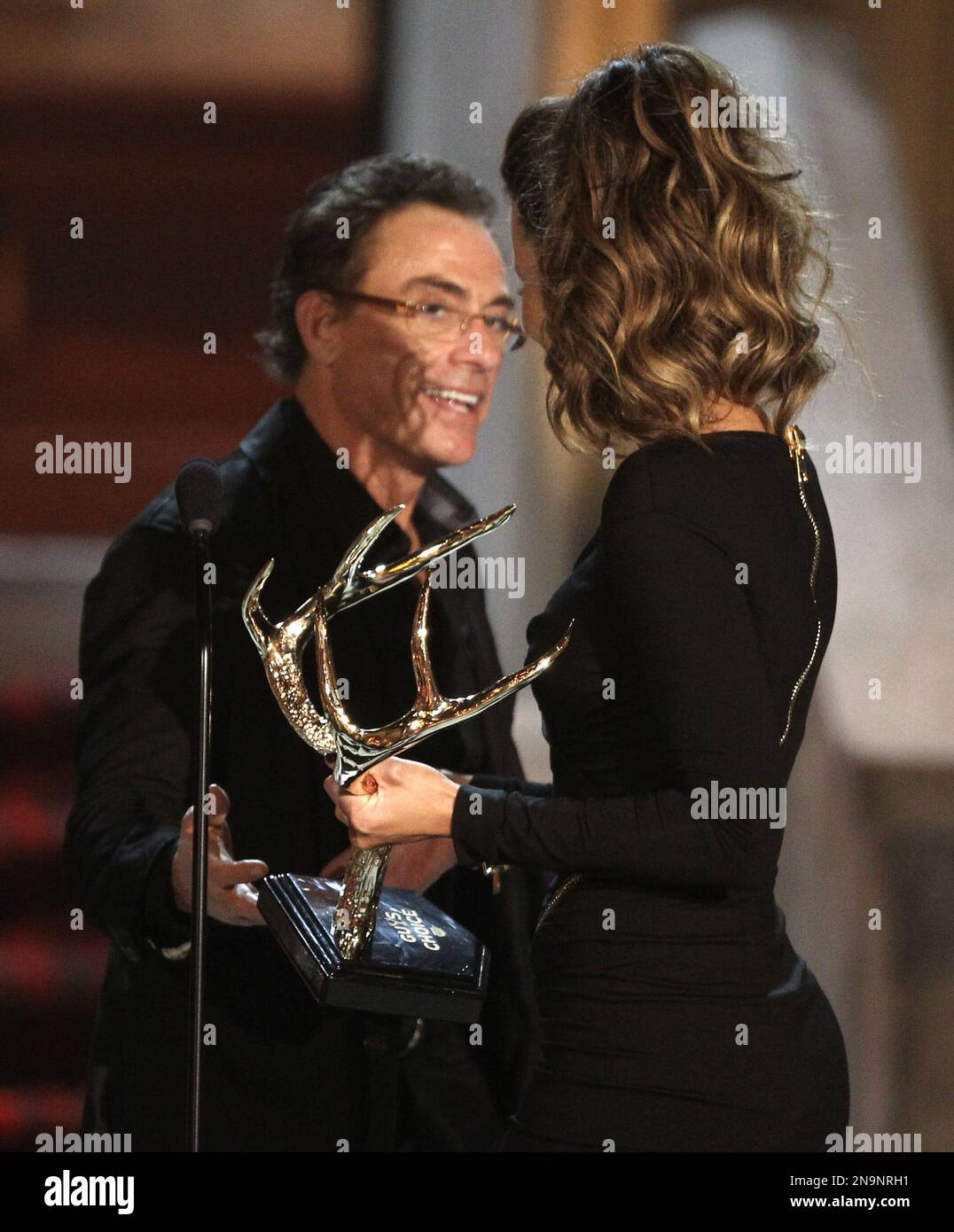 Jean-Claude Van Damme, left, presents the Jean-Claude gahd dam award to ...
