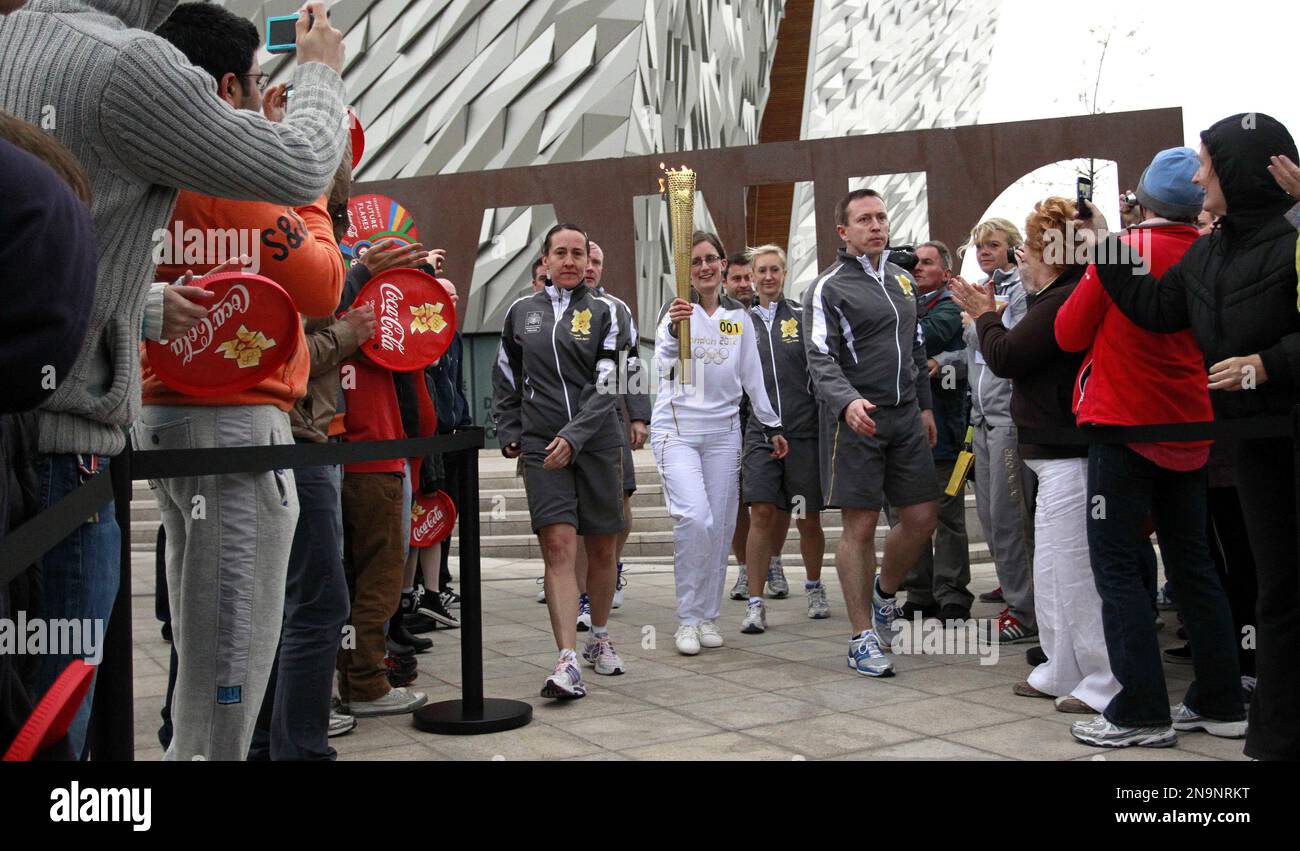 Karen Marshall, the first torch bearer from Northern Ireland, carries ...
