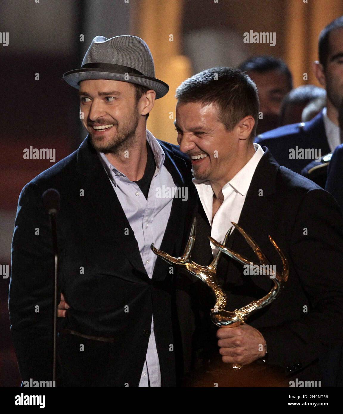 Jeremy Renner, right, presents the troops' choice for entertainer of ...