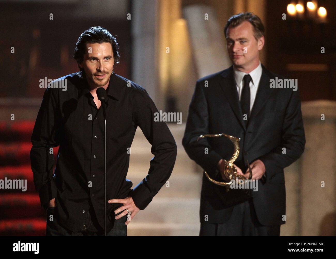 Christian Bale, left, and Christopher Nolan accept the most ...