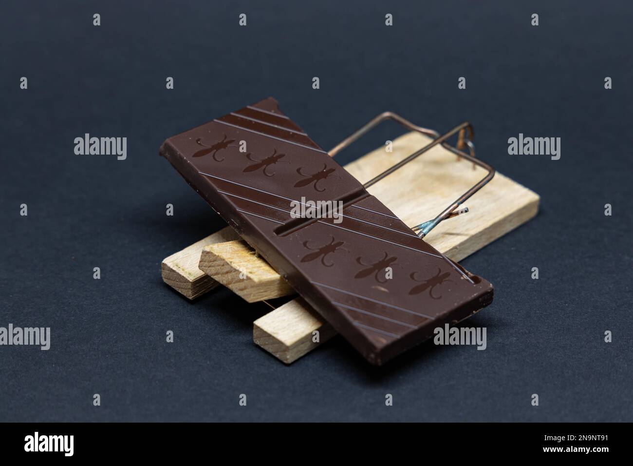 mouse trap with a chocolate bait Stock Photo - Alamy