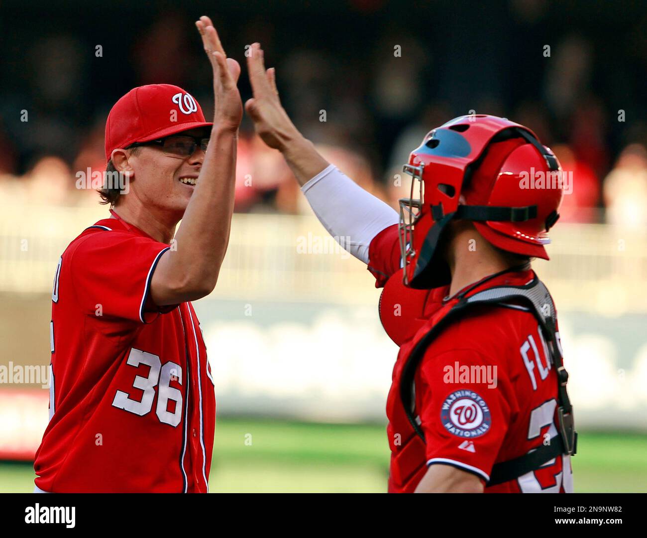 Washington Nationals relief pitcher Tyler Clippard, left, high-fives ...