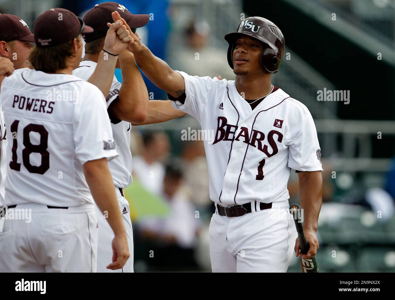 Missouri State's Keenen Maddox (1) is met by Jake Powers (18) after ...