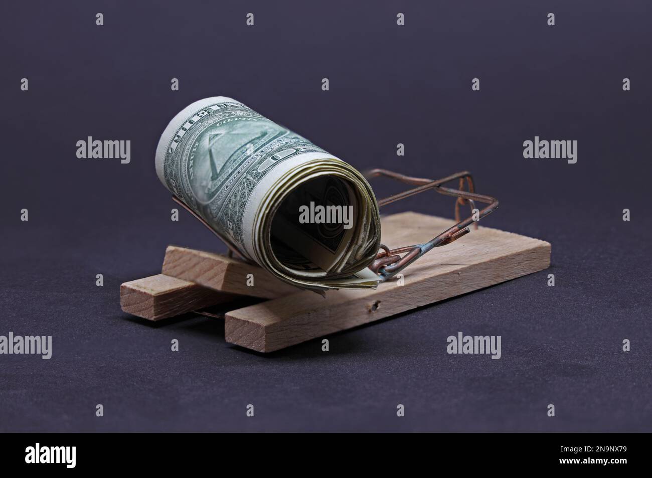 mouse trap with a money bait Stock Photo - Alamy