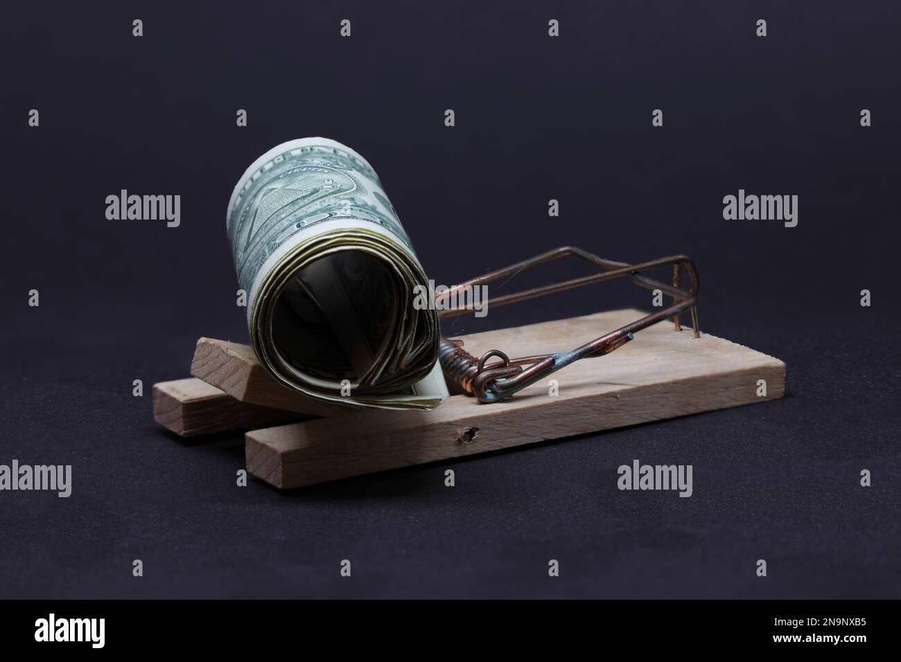 mouse trap with a money bait Stock Photo - Alamy