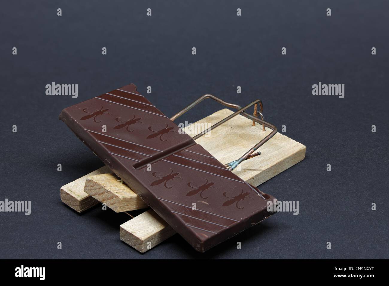 mouse trap with a chocolate bait Stock Photo - Alamy