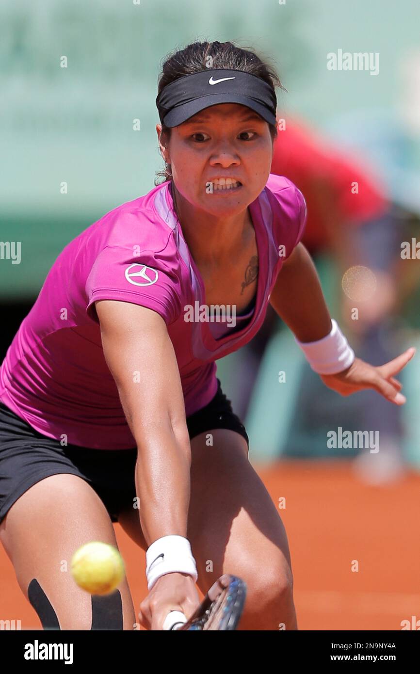 Li Na of China returns in her third round match against Christina ...
