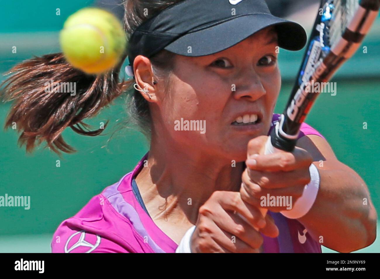 Li Na of China returns in her third round match against Christina ...