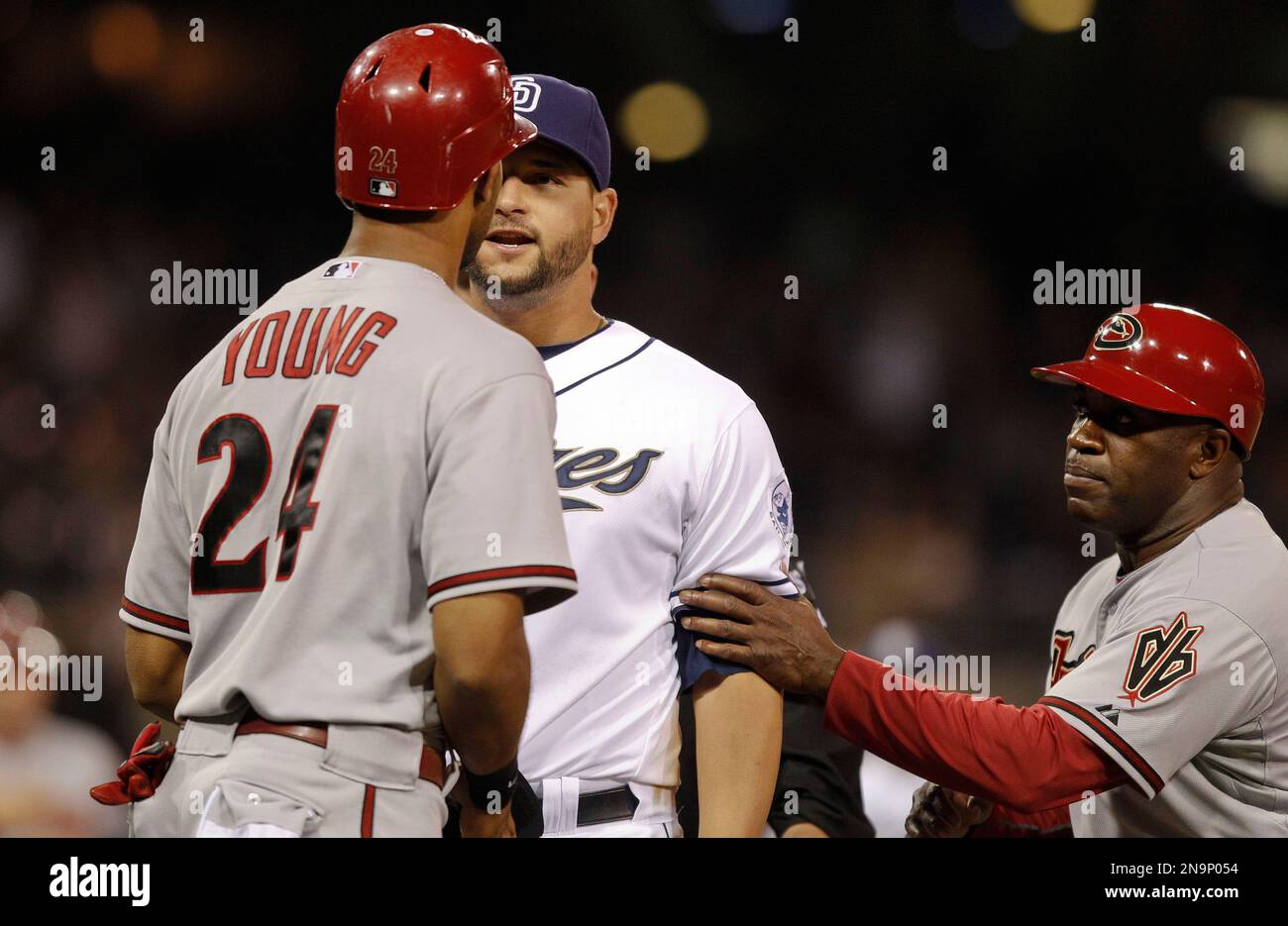 San Diego Padres first baseman Yonder Alonso, who is being restrained ...