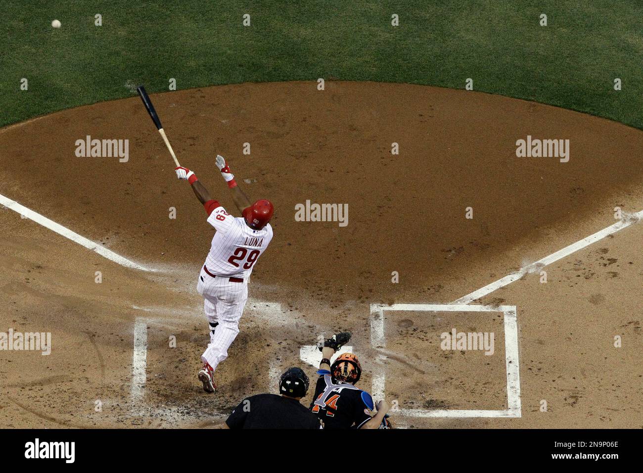Philadelphia Phillies' Hector Luna follows through on a two-run single ...