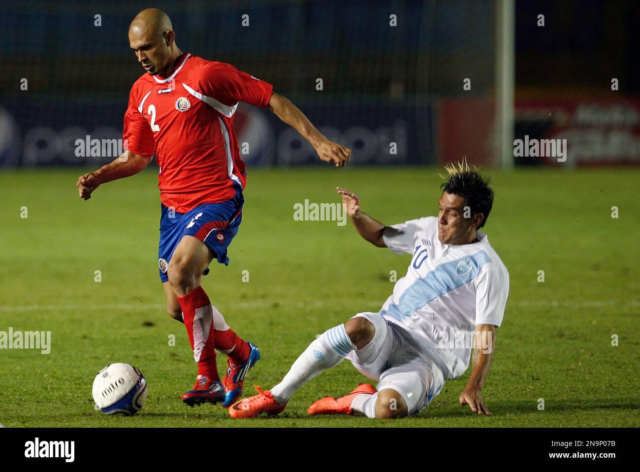 Costa Rica's Heiner Mora, left, and Guatemala's Mario Rodriguez, right ...