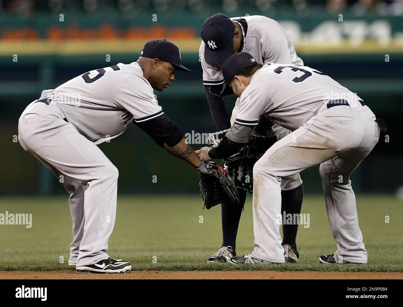 New York Yankees outfielders Dewayne Wise, from left, Curtis Granderson ...