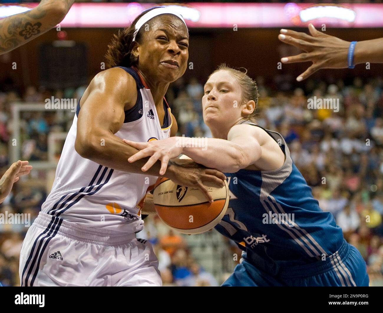 Connecticut Sun's Danielle McCray, left, is pressured by Minnesota Lynx ...