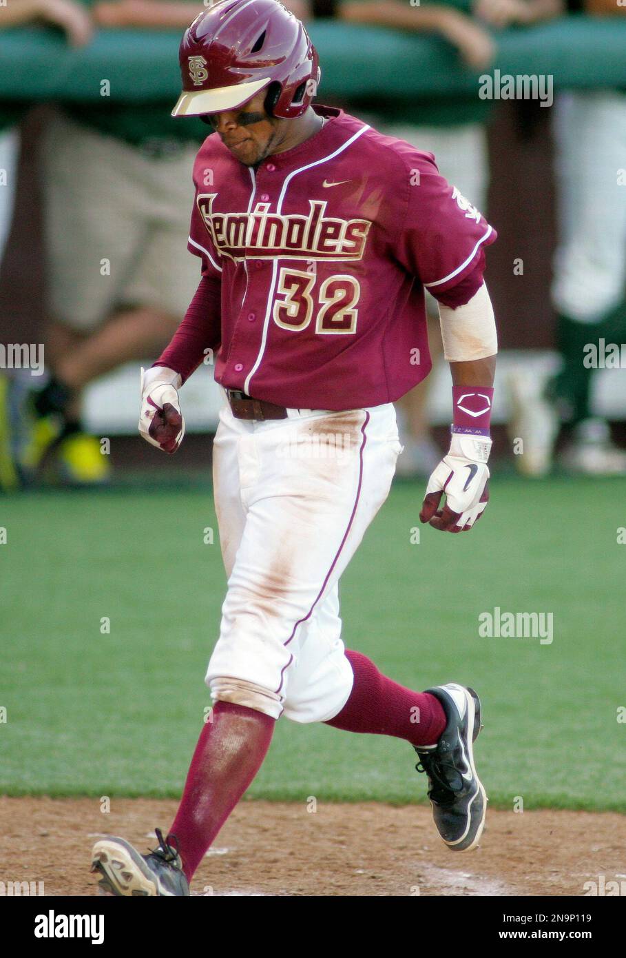 Florida State's Sherman Johnson scores in the fifth inning of an NCAA ...