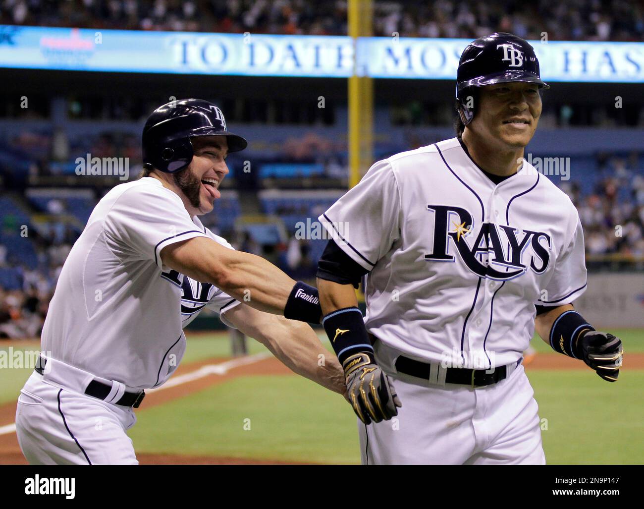 Tampa Bay Rays' Luke Scott, left, congratulates teammate Hideki Matsui ...