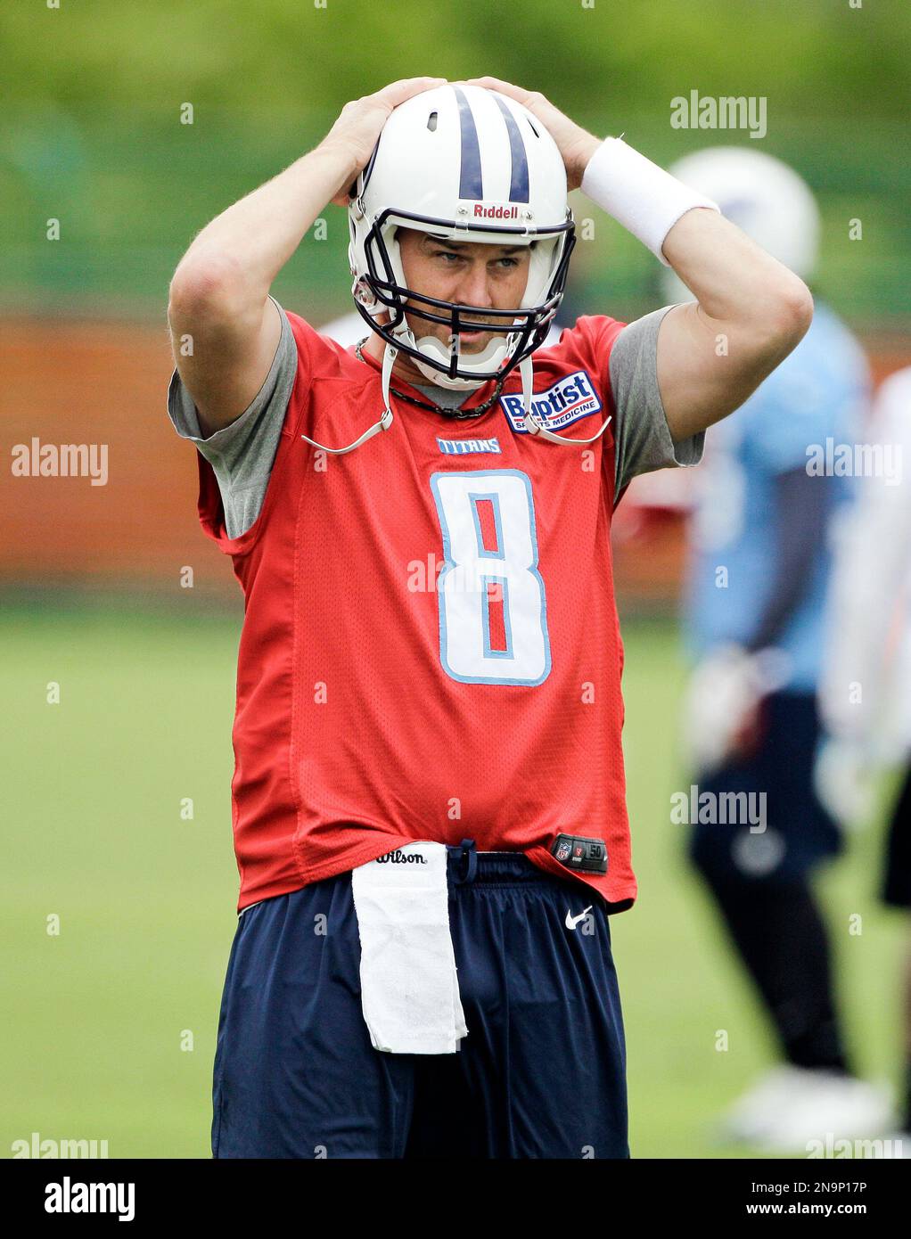 Tennessee Titans quarterback Matt Hasselbeck puts on his helmet during ...
